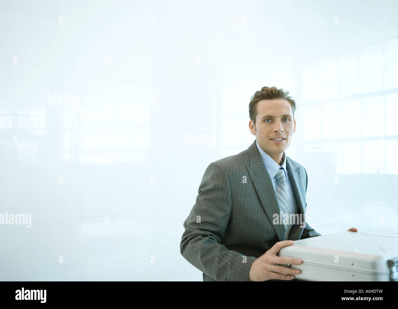 Businessman opening briefcase Stock Photo - Alamy