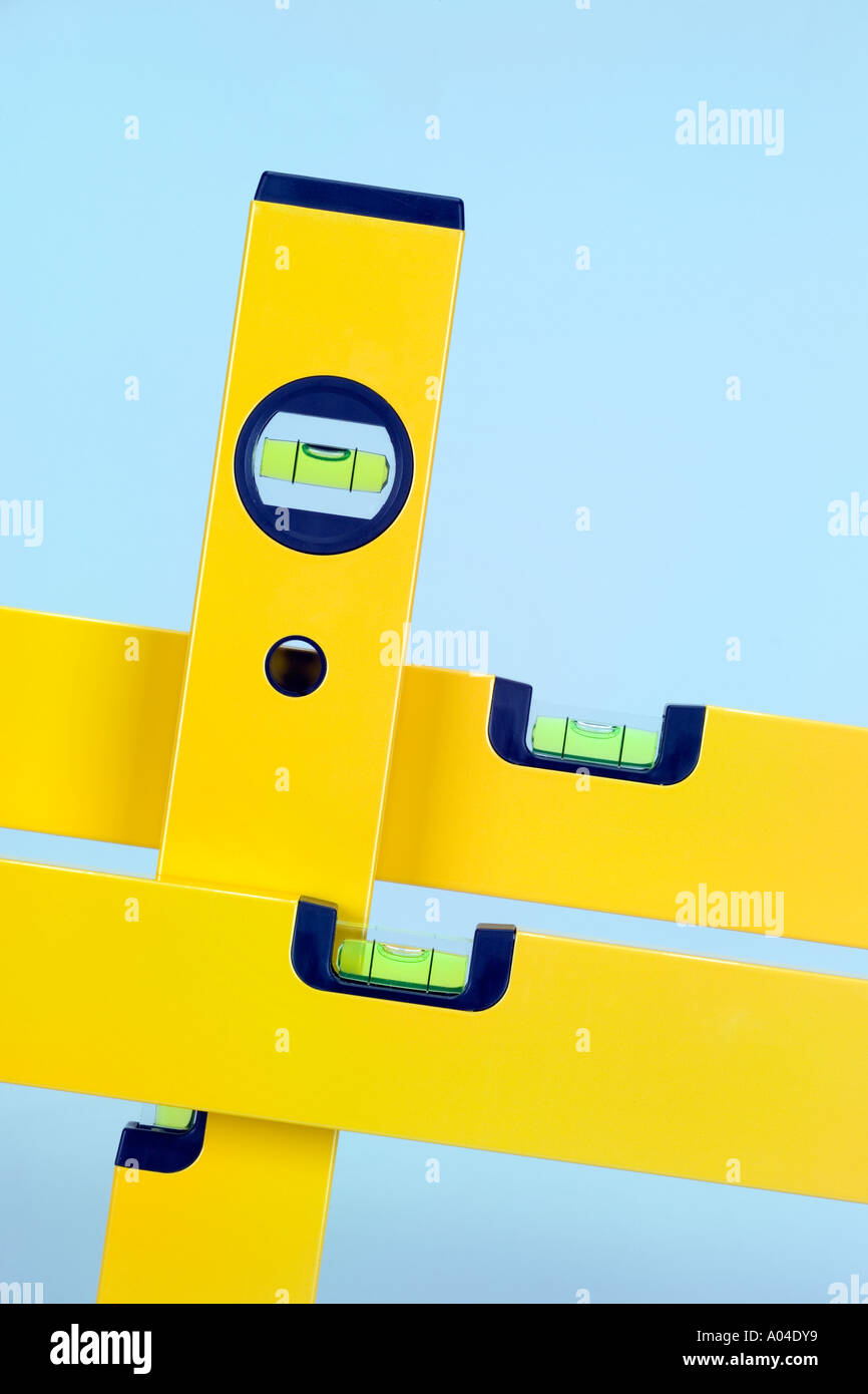 three Yellow angled builders spirit levels with green bubble Stock ...