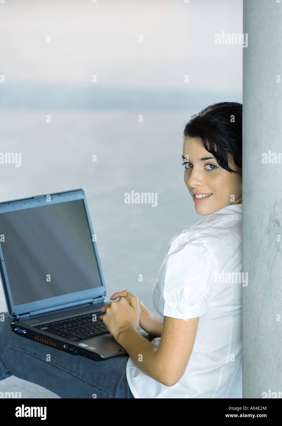Woman looking at screen from rear smile hi-res stock photography and ...