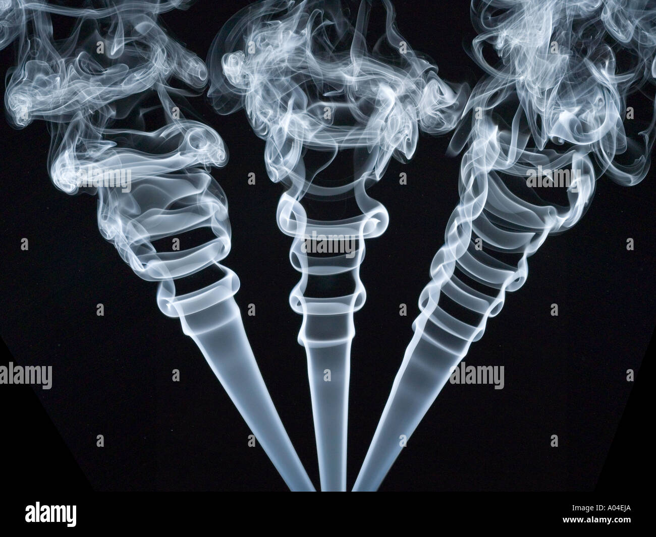 3 plumes of smoke showing natural vortex Stock Photo - Alamy