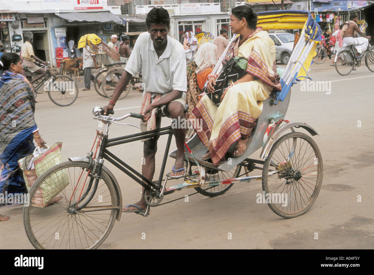 India Orissa Puri cycle rickshaw people Stock Photo - Alamy