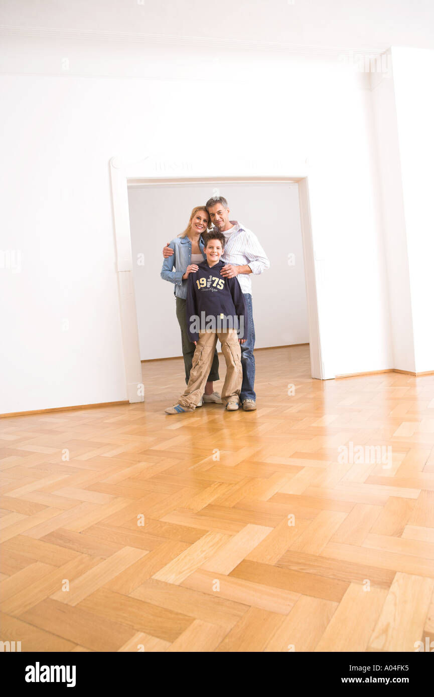 portrait of family in their empty new home Stock Photo - Alamy
