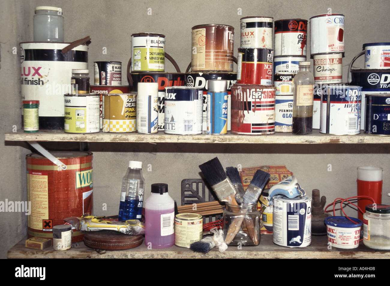 Close up of domestic house garage wood shelving storage for DIY paint ...