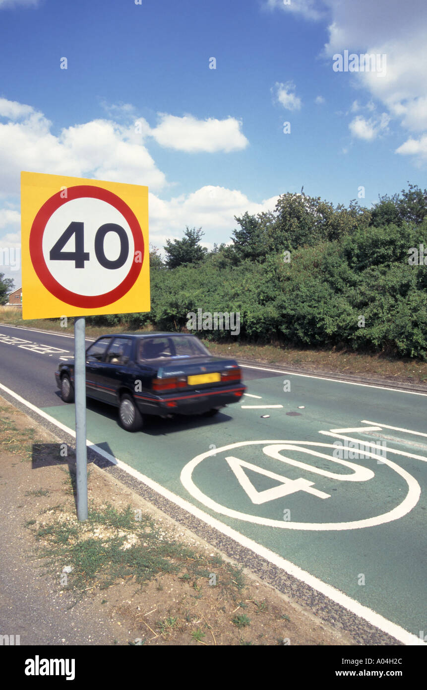 40mph road traffic sign duplicated with green markings on tarmac road ...