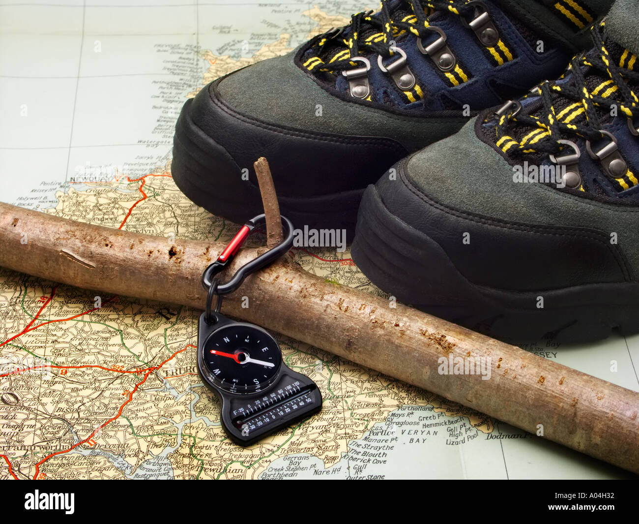 Hiking boots and stick Stock Photo - Alamy