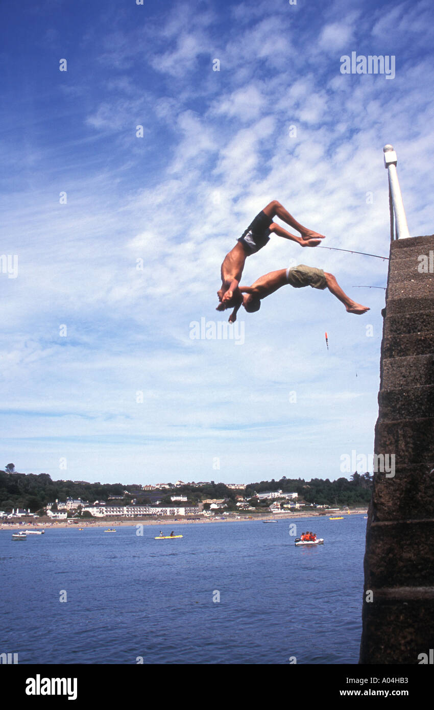 Two boys jumping into the sea hi-res stock photography and images - Alamy