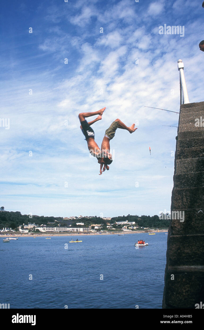 Two boys jumping into the sea hi-res stock photography and images - Alamy