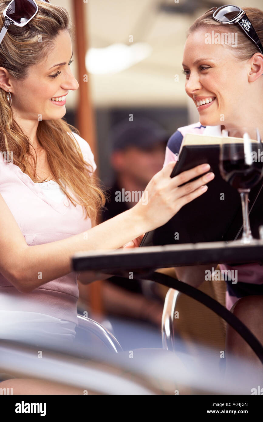 Women reading menu at cafe Stock Photo - Alamy
