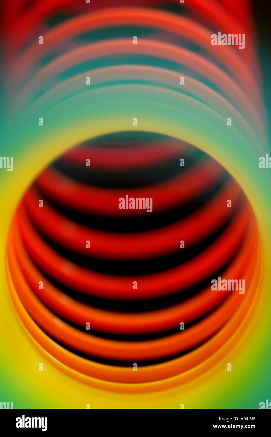 Slinky toy black background Stock Photo - Alamy