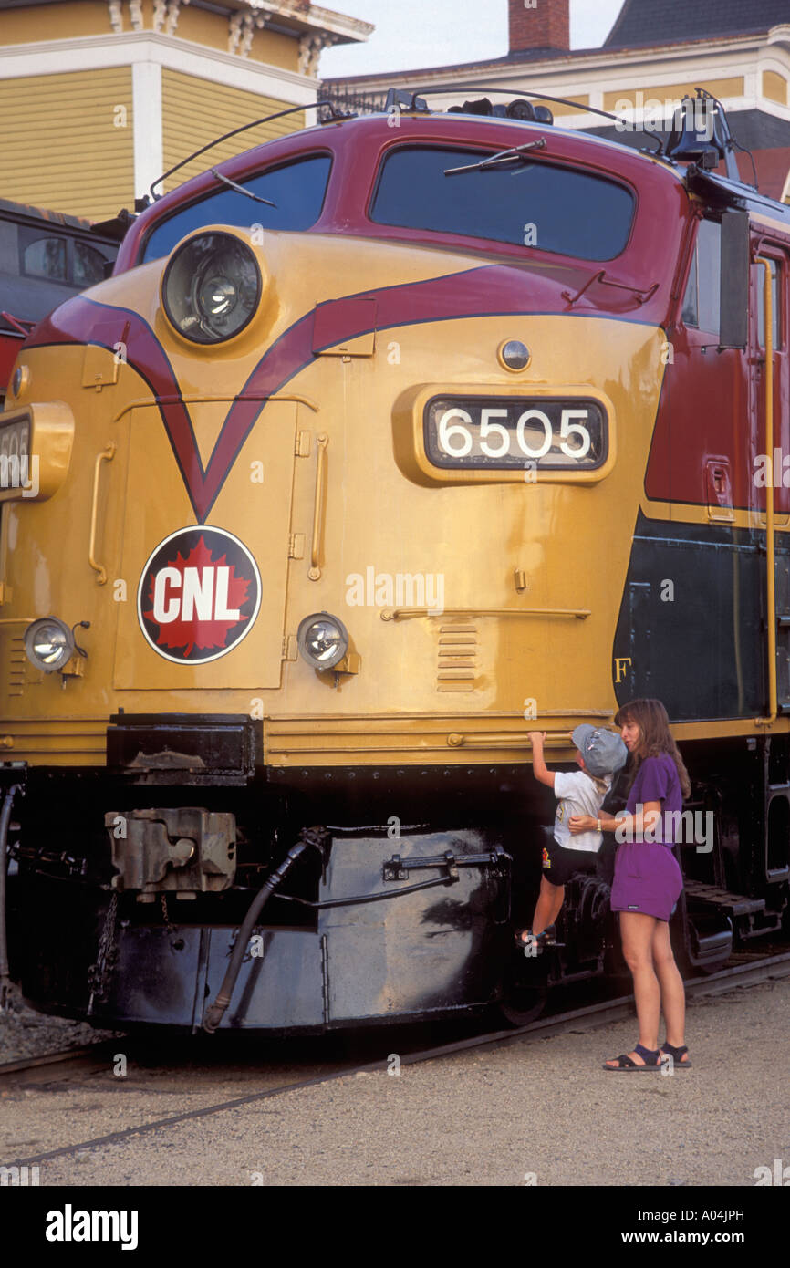 MOTHER AND SON LOOK AT RESTORED DIESEL ELECTRIC POWERED LOCOMOTIVE ...