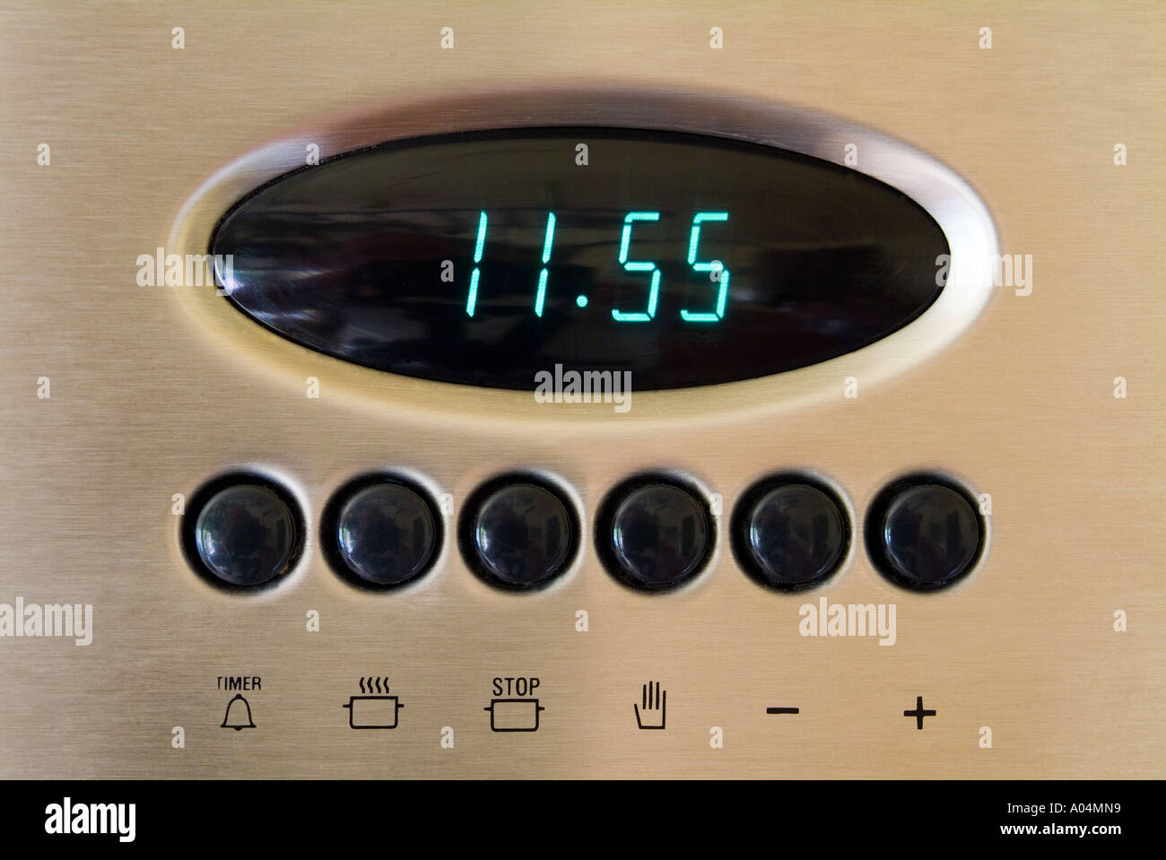 Oven timer on a modern stainless steel oven Stock Photo - Alamy