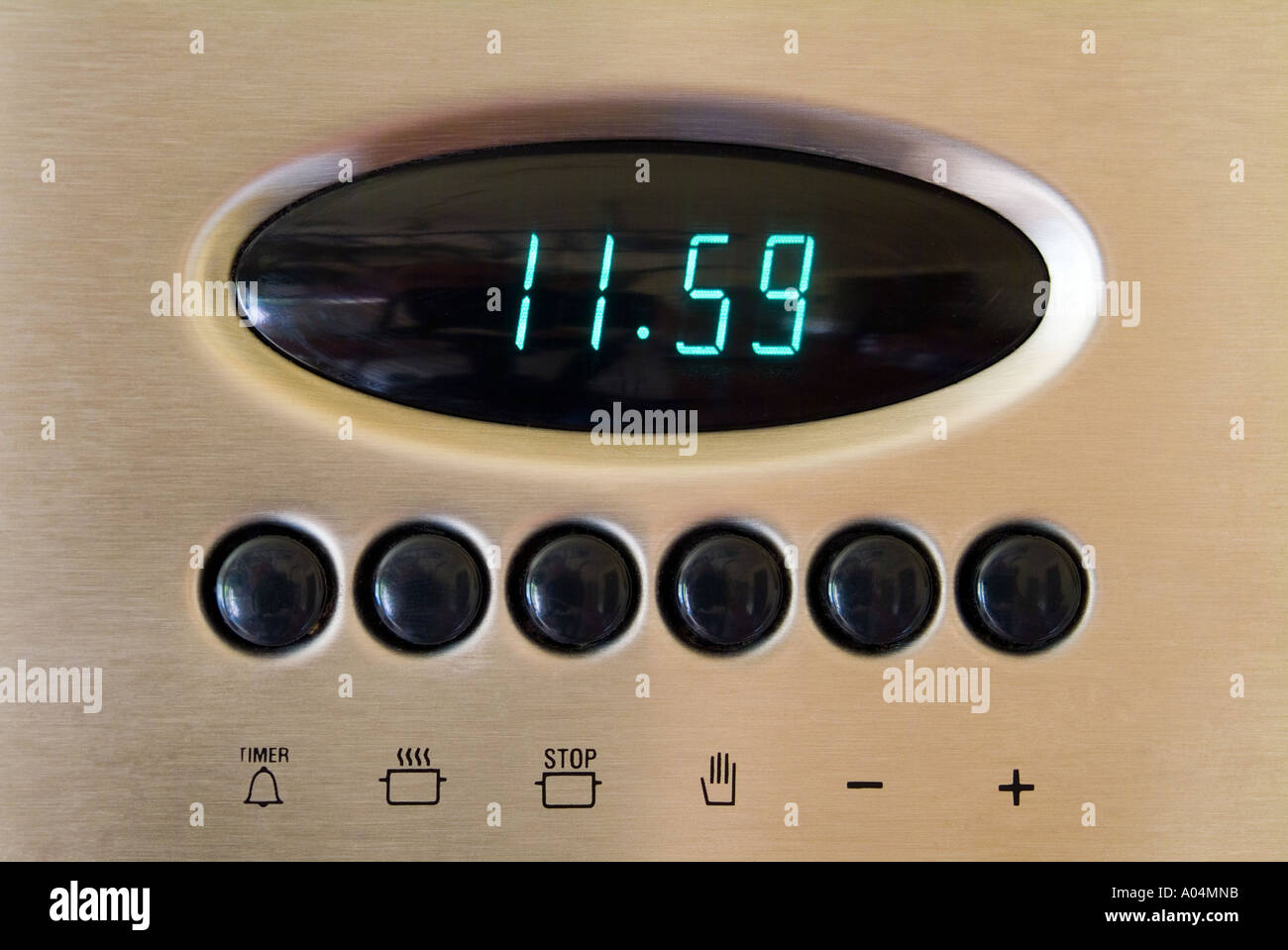 Oven timer on a modern stainless steel oven Stock Photo - Alamy
