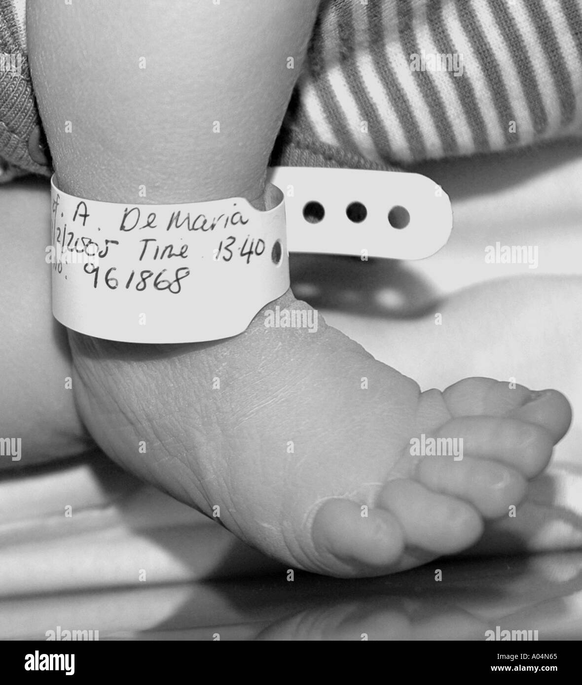 baby s feet with name tag Stock Photo - Alamy