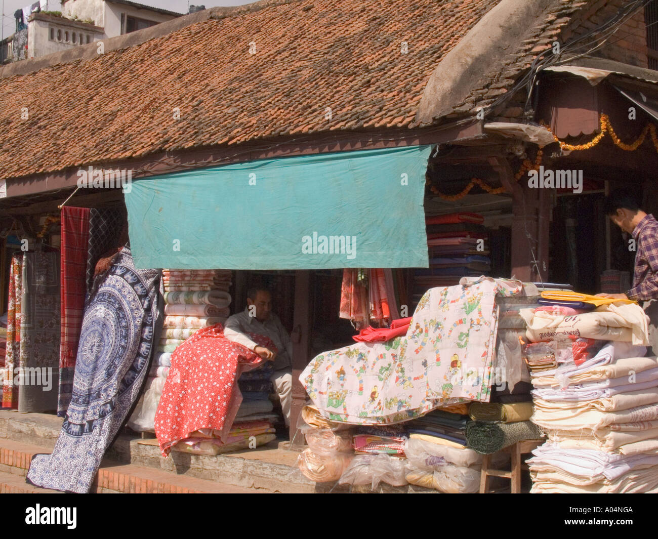 PATAN NEPAL November An shop selling household textiles in Durbar ...