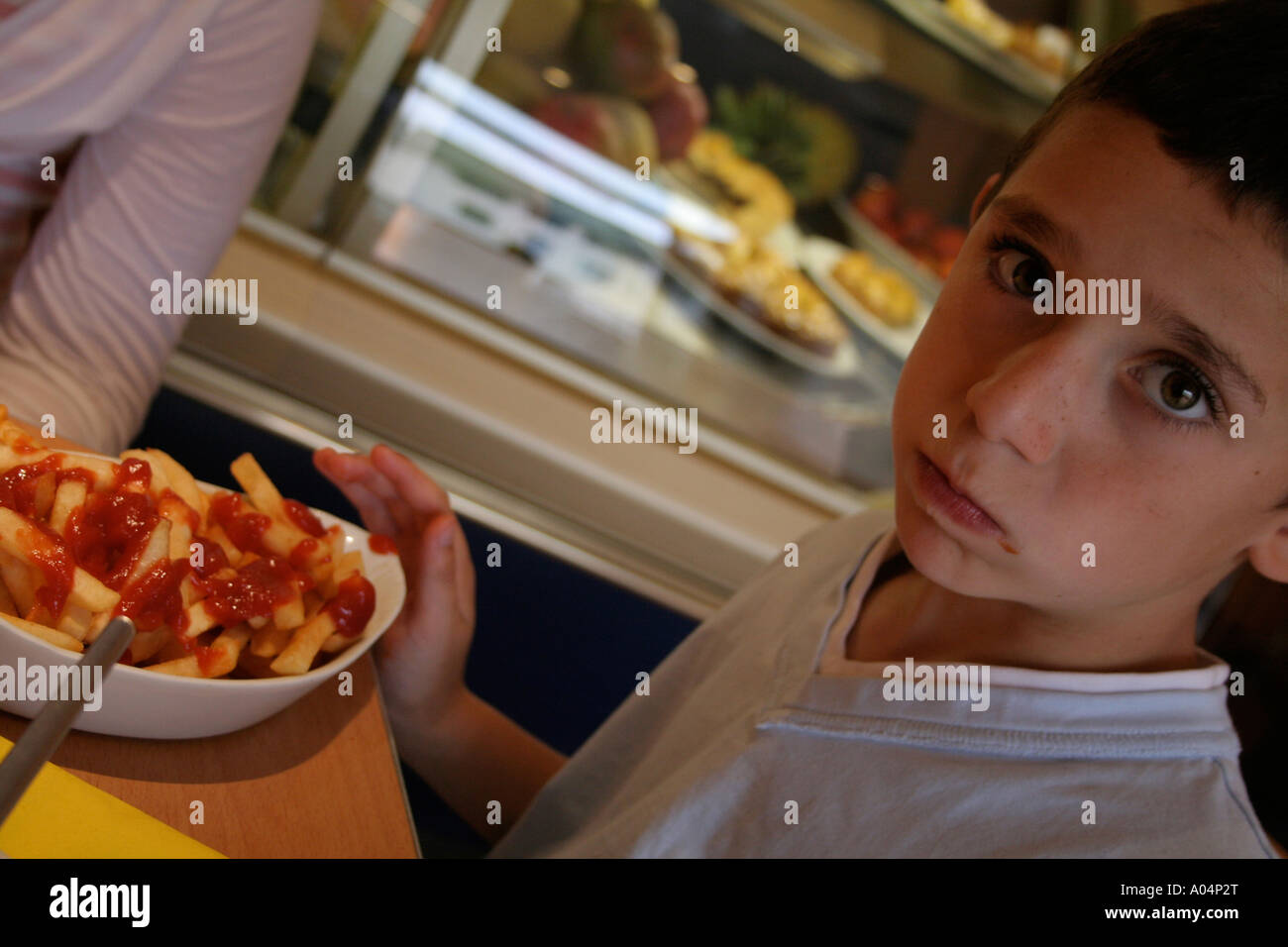 Child eating chips hi-res stock photography and images - Alamy