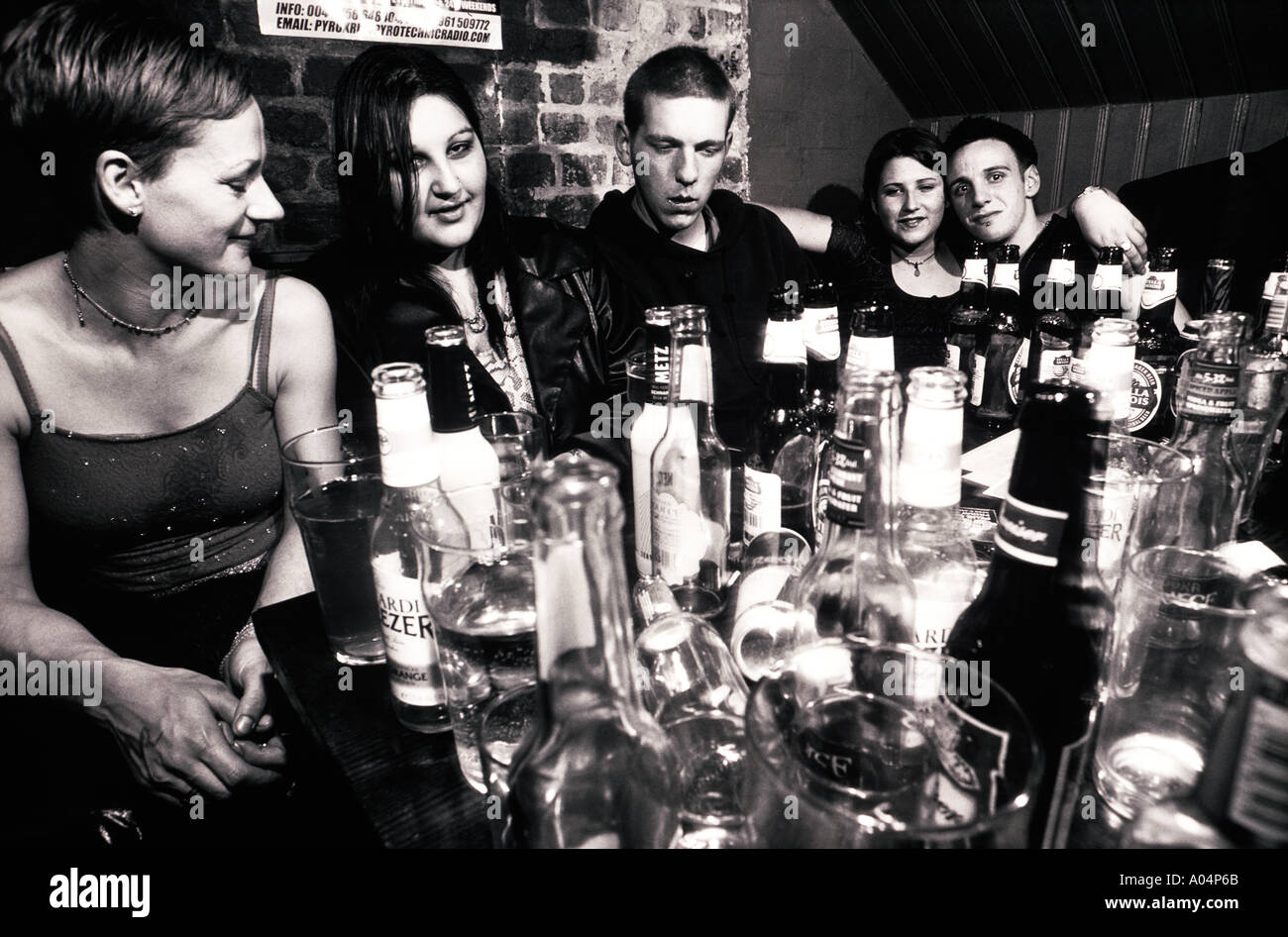 Friends at a pub during heavy drinking session Stock Photo - Alamy