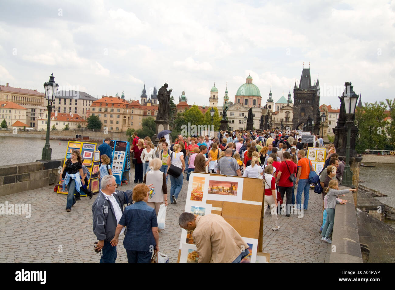 Crowds and artists on the famous Charles Bridge of tourist city of ...
