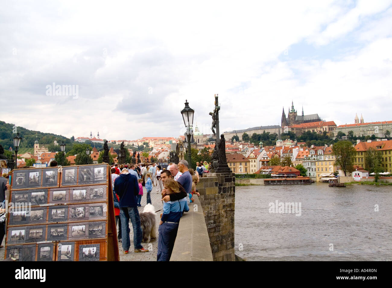 Crowds and artists on the famous Charles Bridge of tourist city of ...