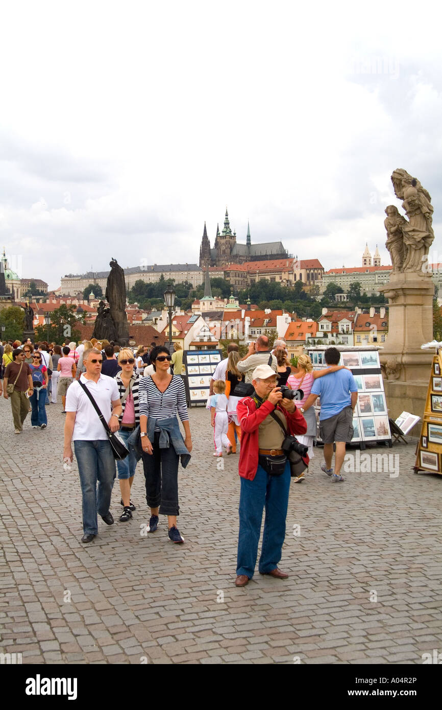 Crowds of people and artists on the famous Charles Bridge of tourist ...