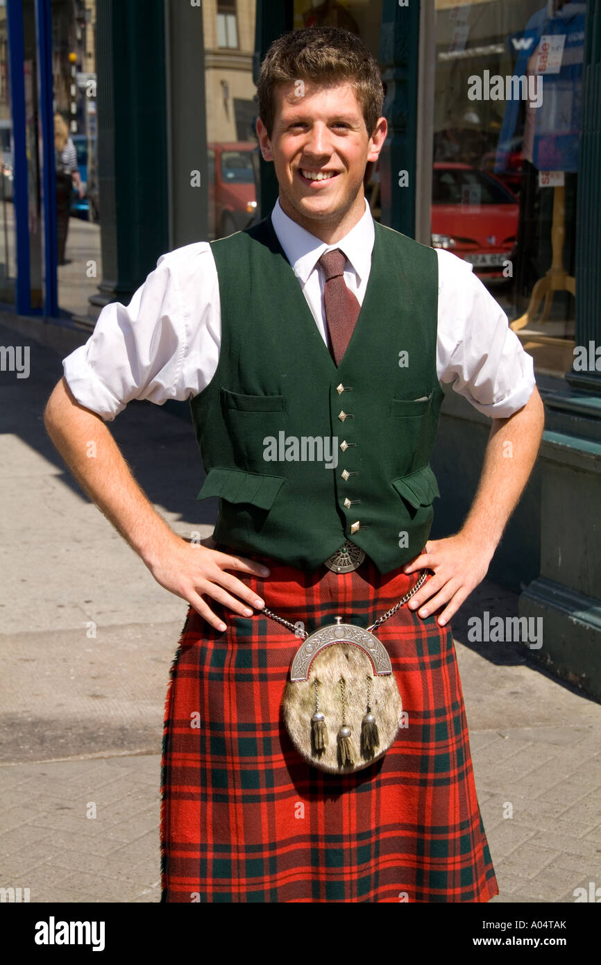 Young attractive local man in traditional kilt in capital of Edinburgh ...