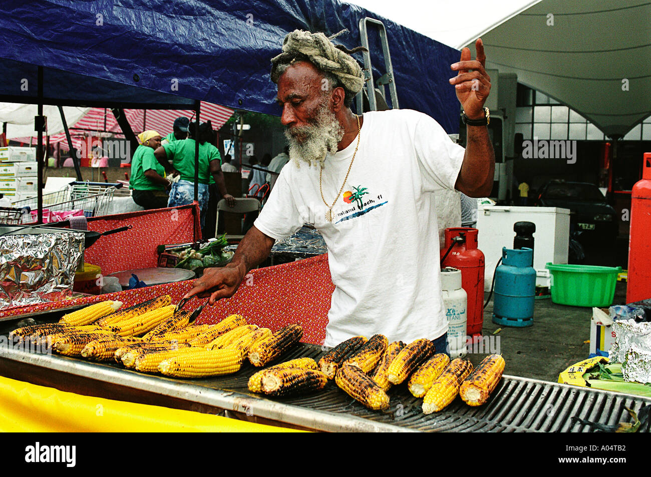 Man selling grilled corn on hi-res stock photography and images - Alamy