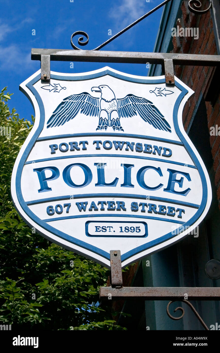USA, Washington, Port Townsend, Police sign hangs off brick building ...