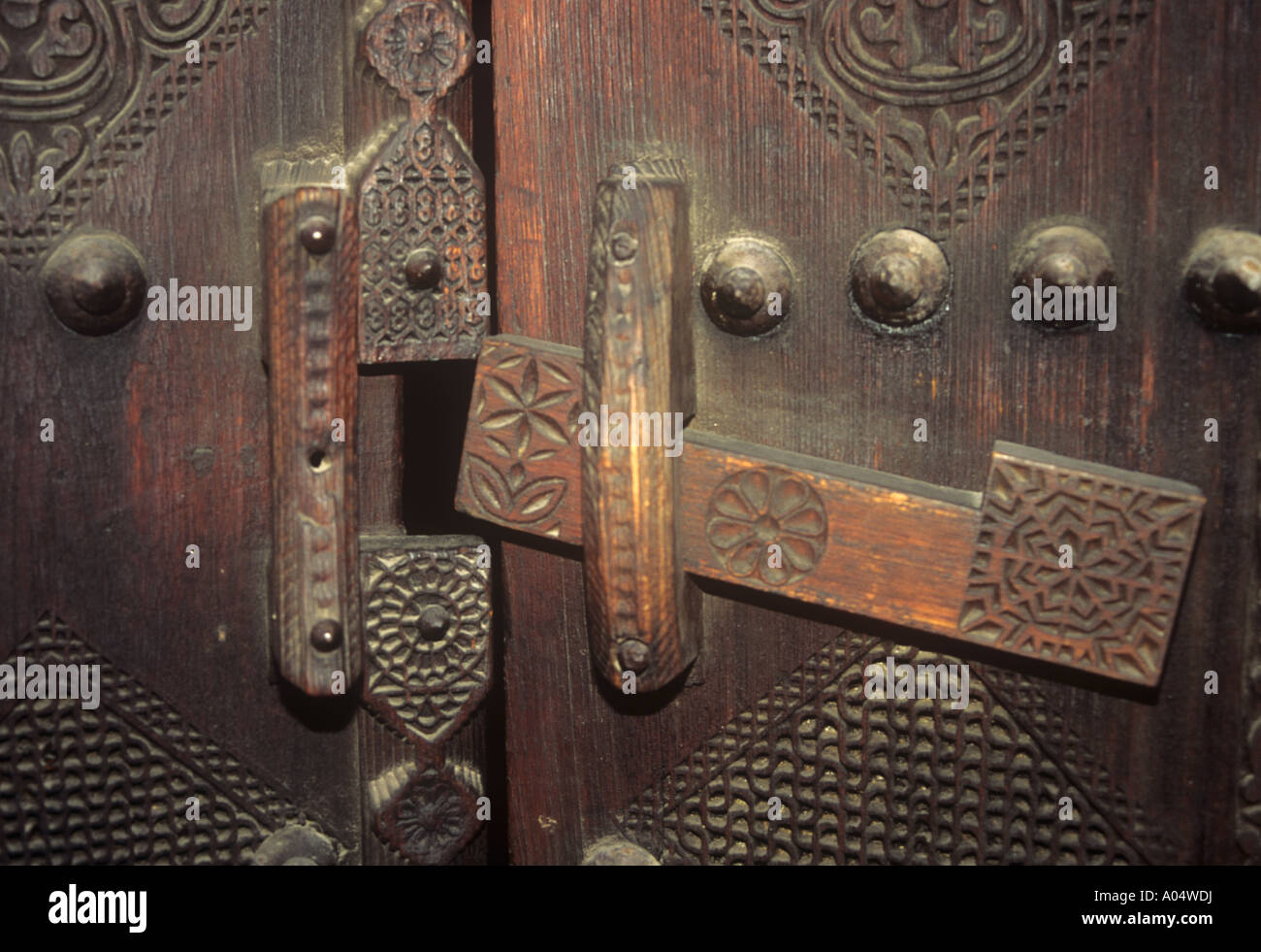 Traditional wooden lock on the door of an old house in Muharraq ...