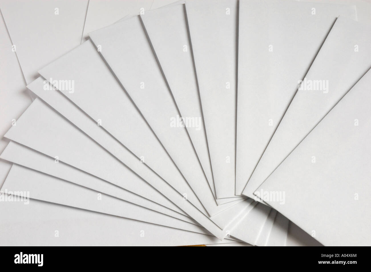 Close up of fanned out envelopes and white paper Stock Photo - Alamy