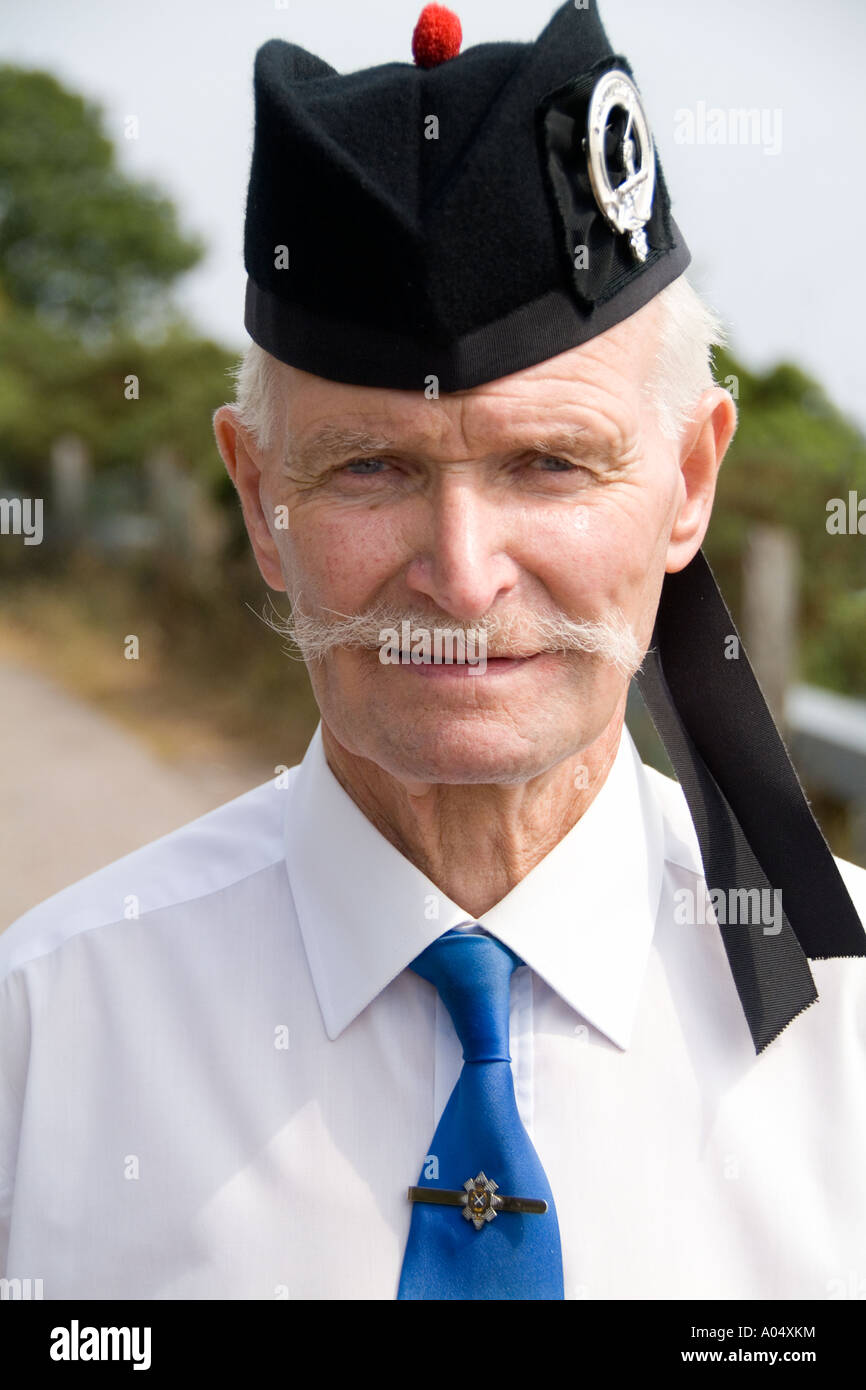 Colorful outfit and personality of bag pipe player at the Loch Ness ...