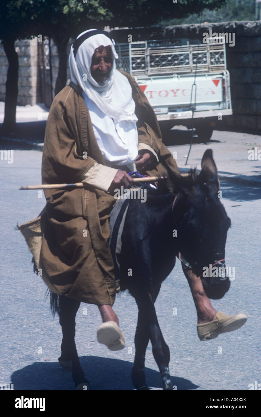 Arab riding donkey on road hi-res stock photography and images - Alamy