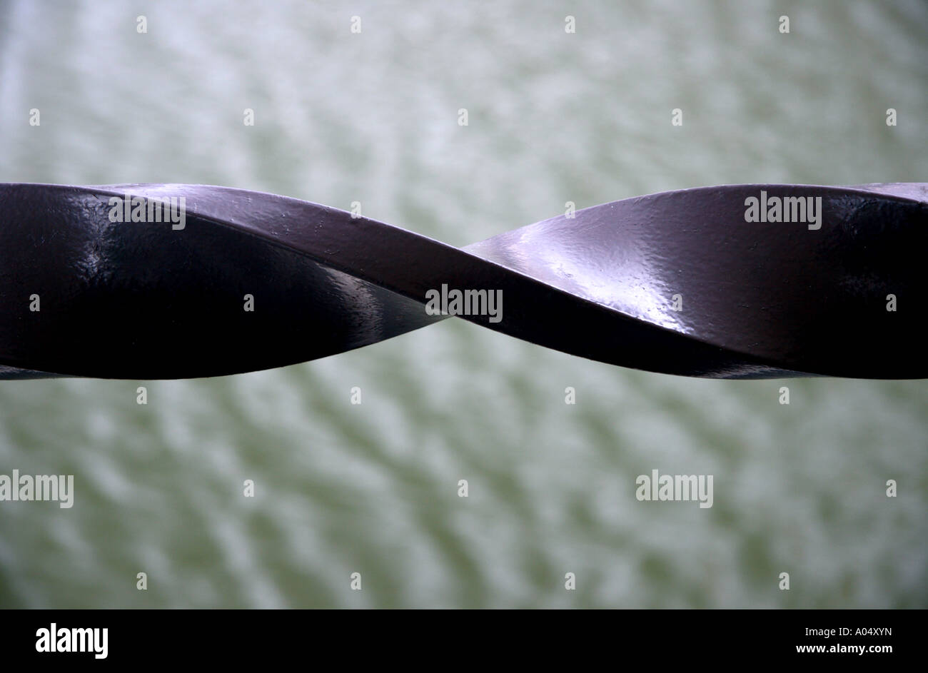 Twisted steel over water Stock Photo - Alamy