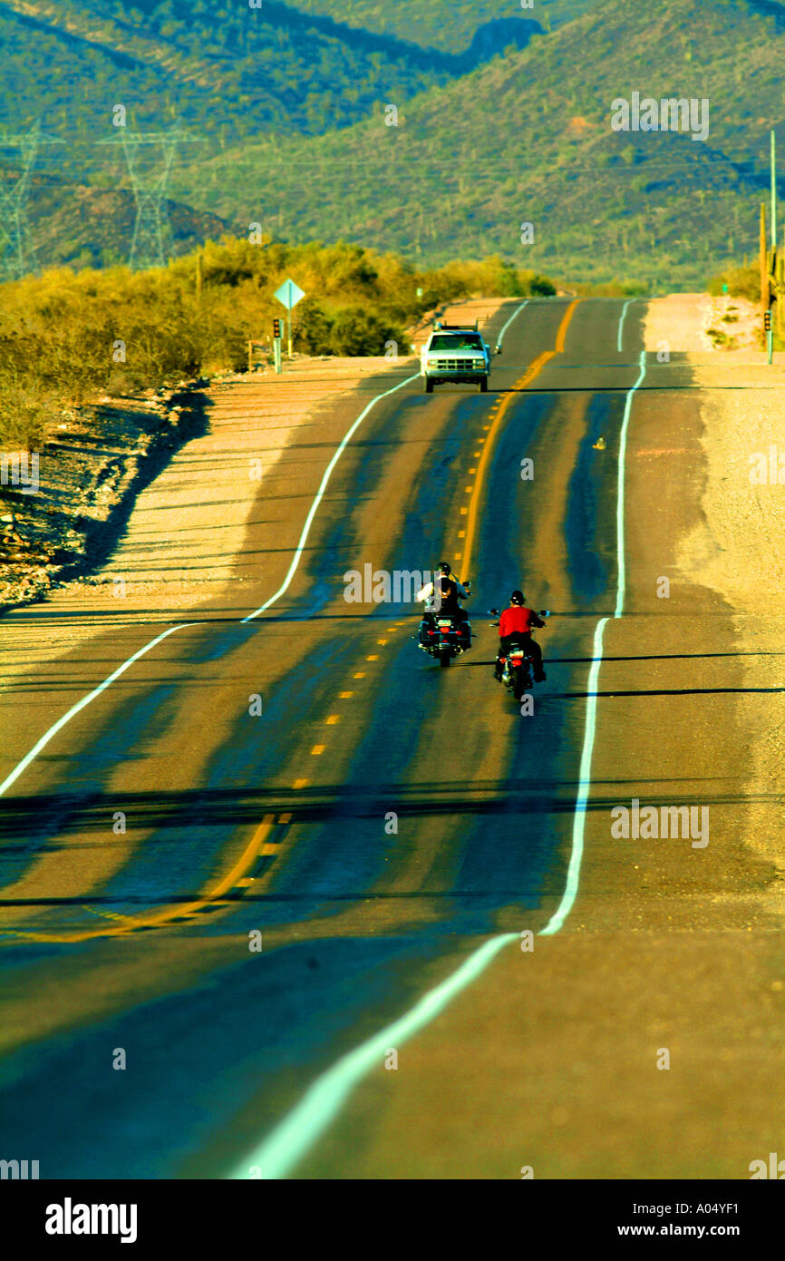 US Road Trip motorbikes and van on an undulating road in Arizona just ...