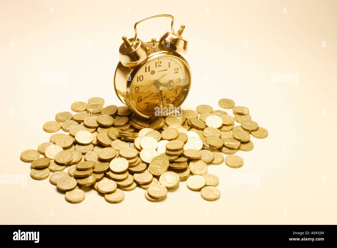Alarm clock time coins hi-res stock photography and images - Alamy