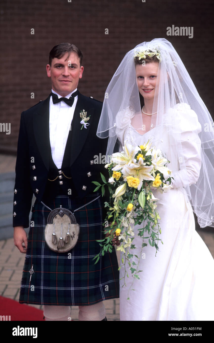 Traditional wedding couple on marriage wedding day in Glasgow Scotland ...