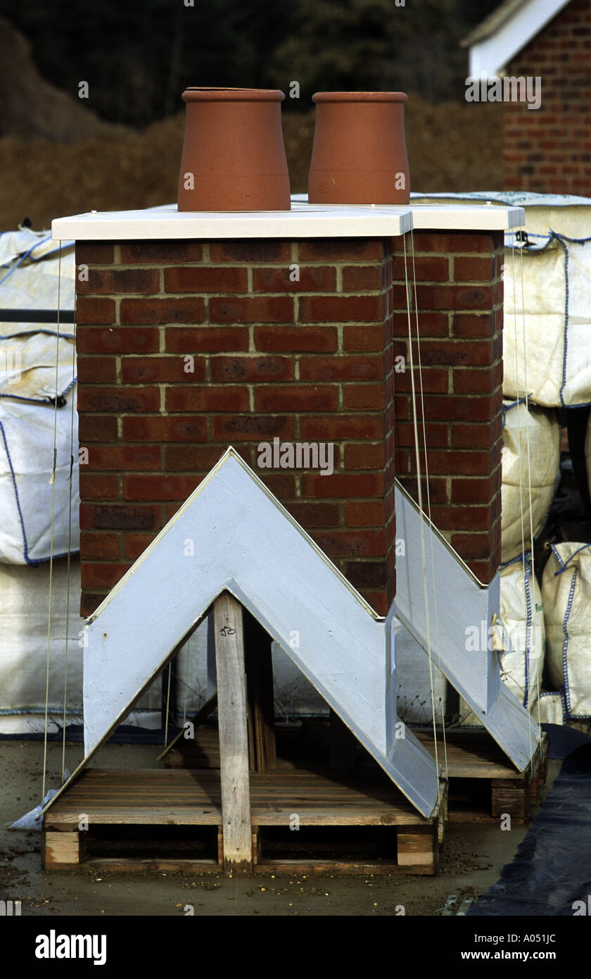 Moulded chimney stacks with pots waiting to be fitted at a housing ...