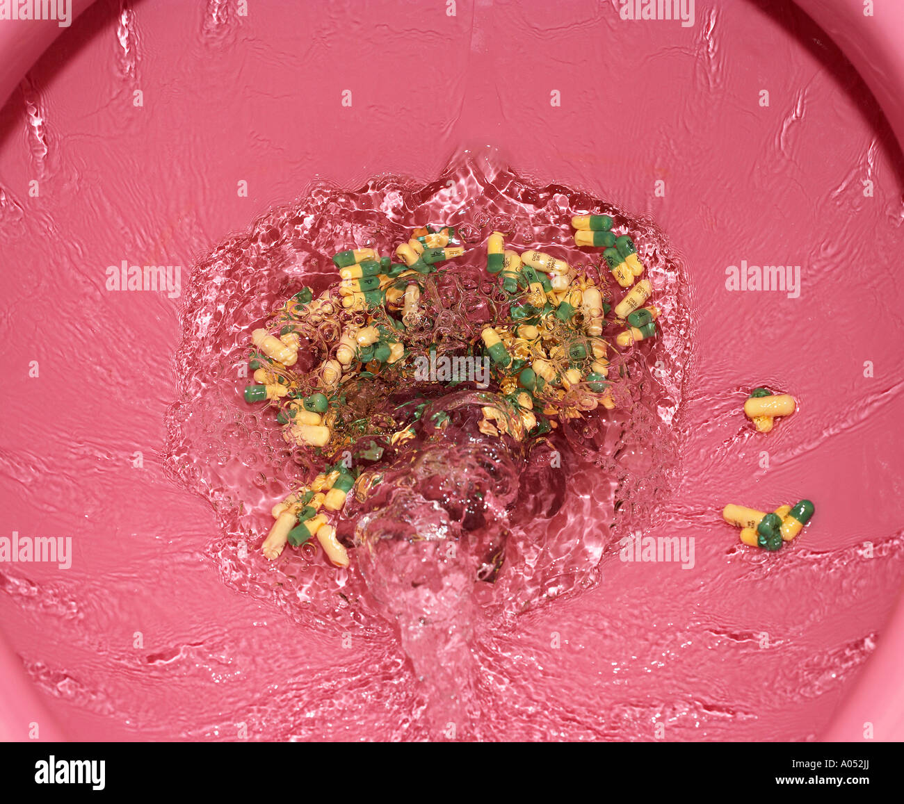 Painkillers being flushed down toilet hi-res stock photography and ...