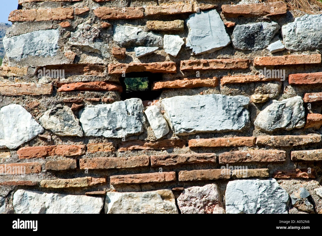 Terracotta brick and stone masonry wall detail, in the city of Ephesus ...