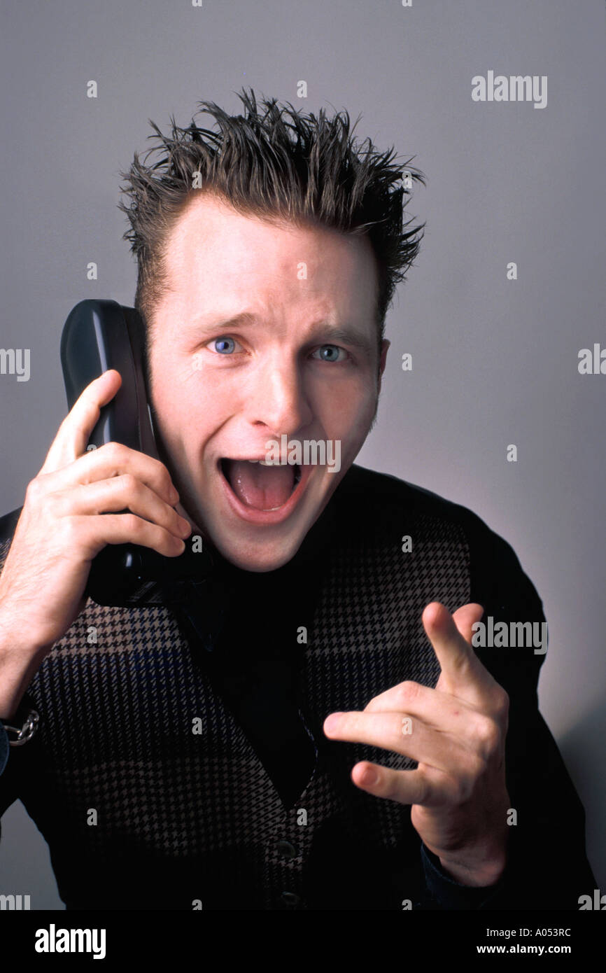 funny man on phone with expressive face pointing his finger and talking ...