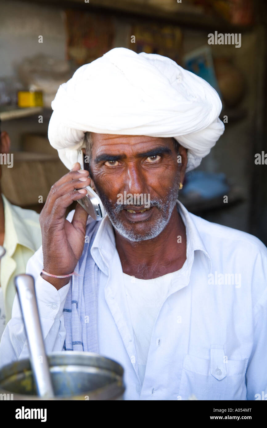 Traditional Hindu vendor man with white turban portrait using modern ...