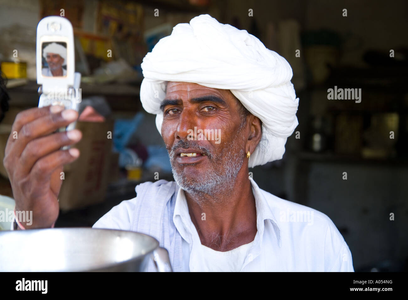 Traditional Hindu vendor man with white turban portrait using modern ...