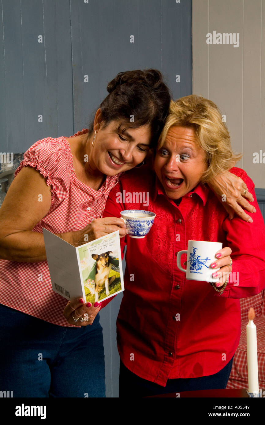 Small town women having coffee and laughing in the kitchen good friends ...