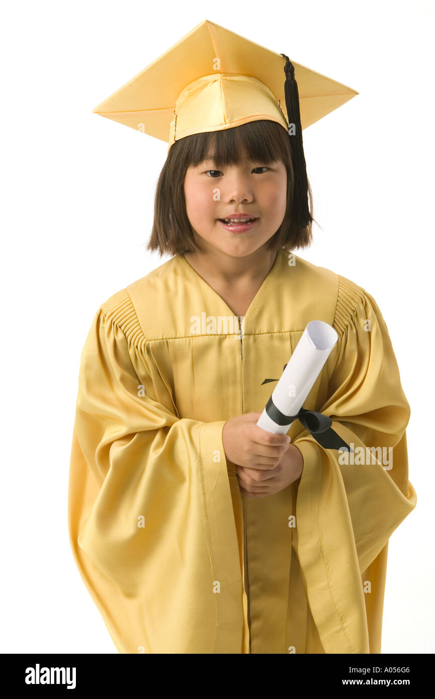 Girl in graduation cap and gown holds diploma Stock Photo - Alamy