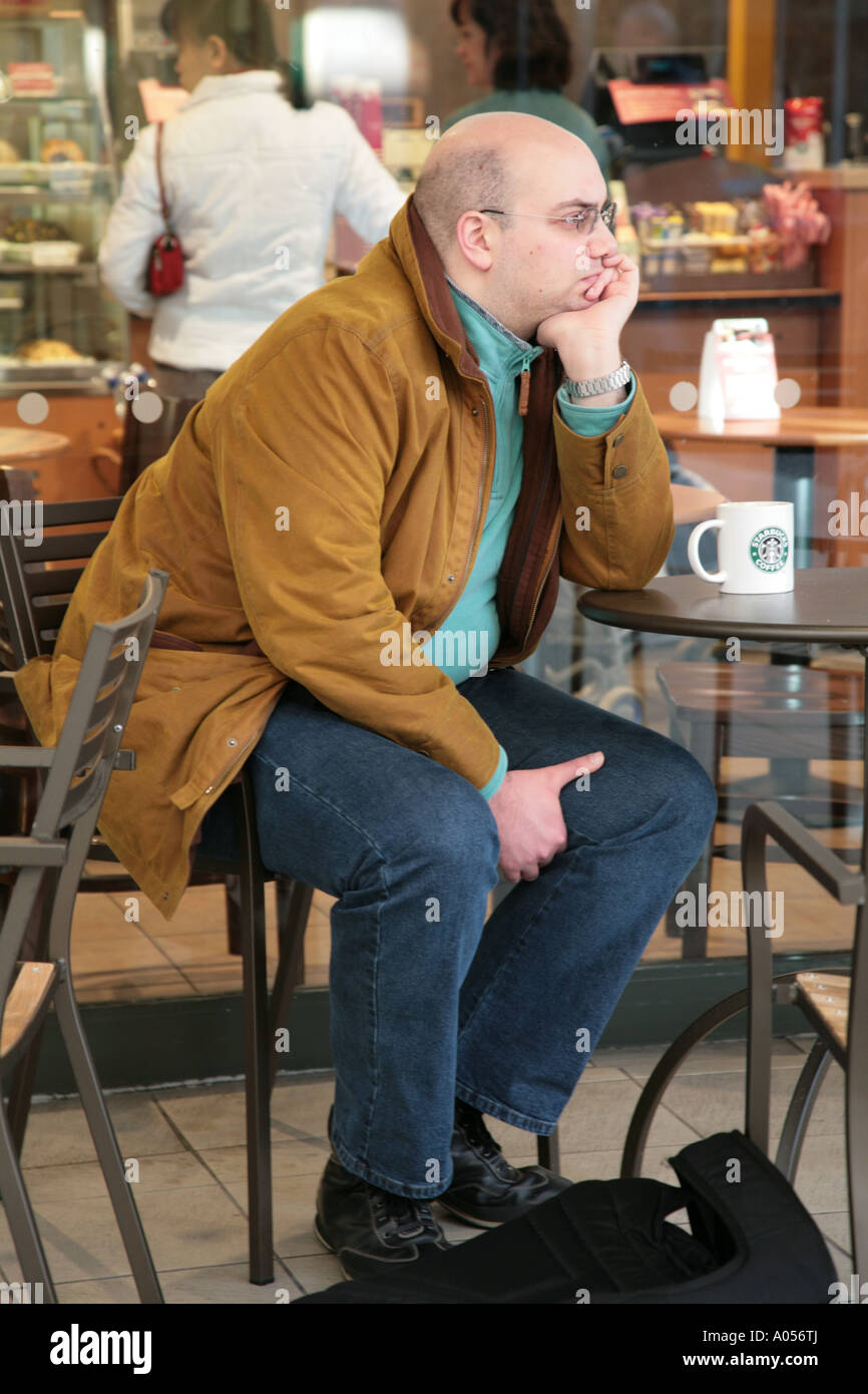 bored man in coffee shop Stock Photo - Alamy
