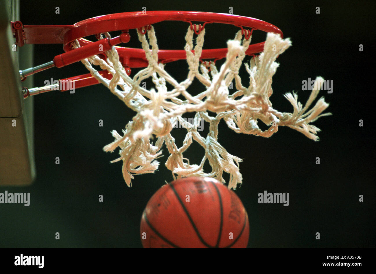 Basketball falling through the net Stock Photo - Alamy