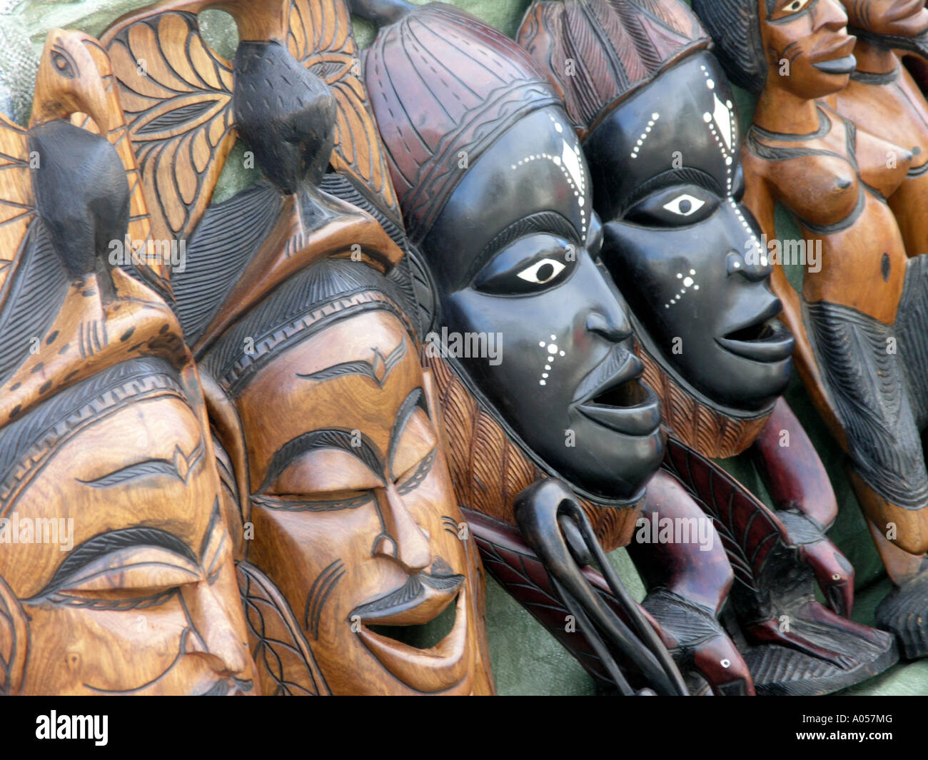 carved wooden masks made by african artists Stock Photo - Alamy