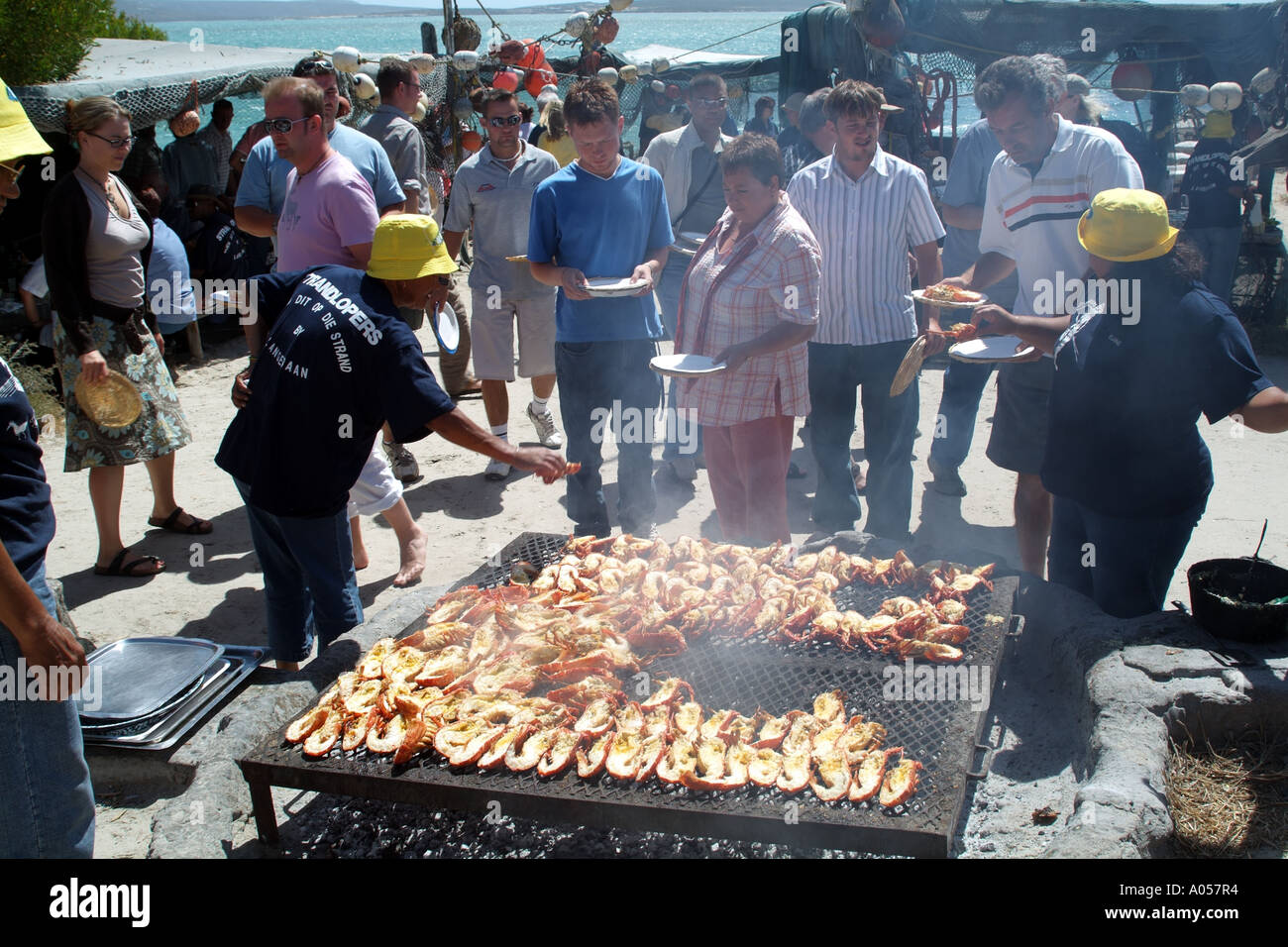 Crayfish being grilled for guests on open fire Langebaan west coast ...