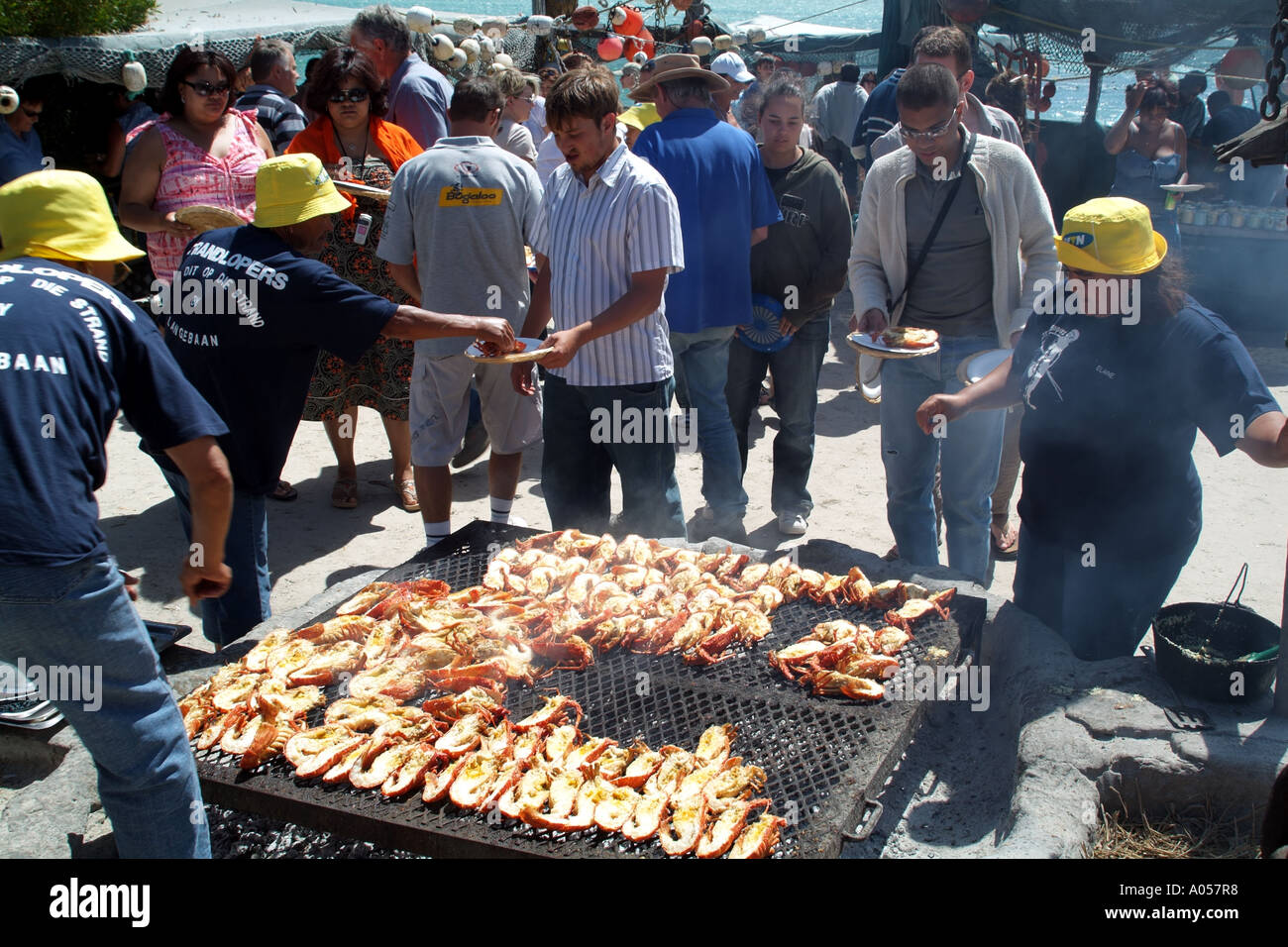 Crayfish being grilled for guests on open fire at Langebaan, west coast ...