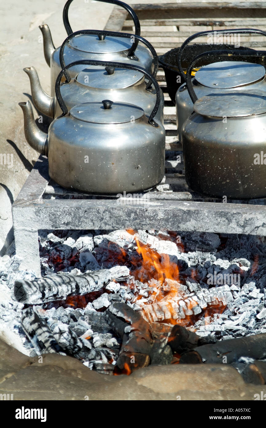 Kettles on the boil over an open fire Beach restaurant western cape ...