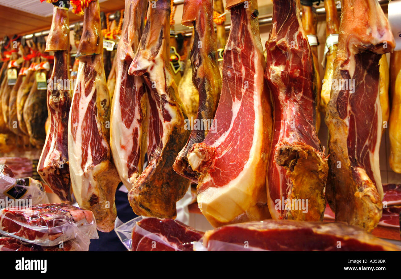 Hams for sale for sale at a market Stock Photo - Alamy