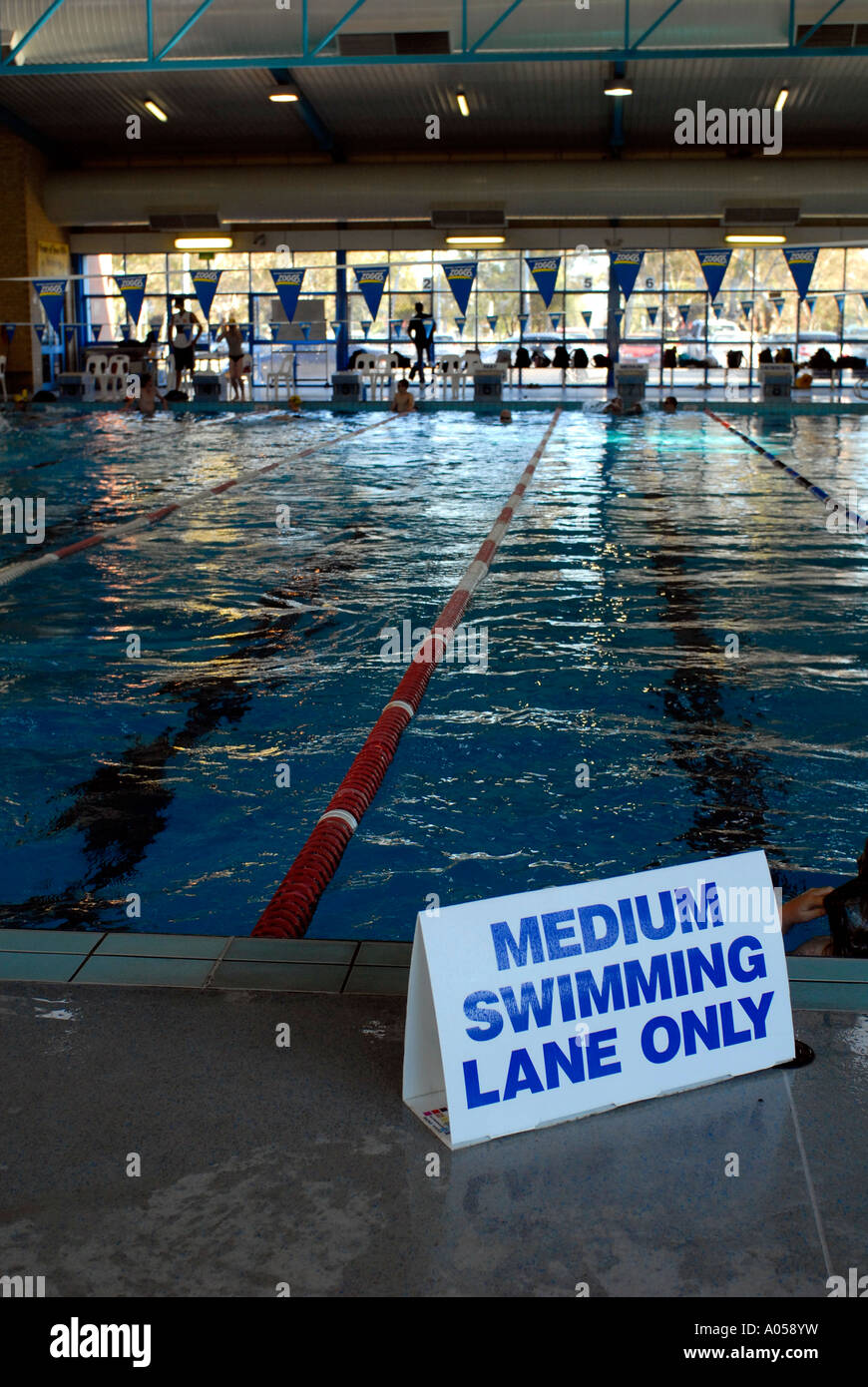 "Medium swimming lane only" sign at public swimming pool Stock Photo ...